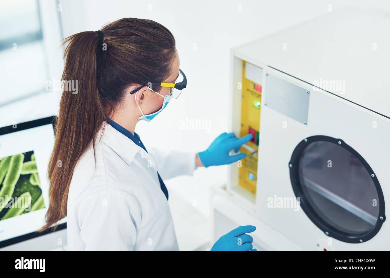 Just a simple push of a button. Rearview shot of an unrecognizable ...