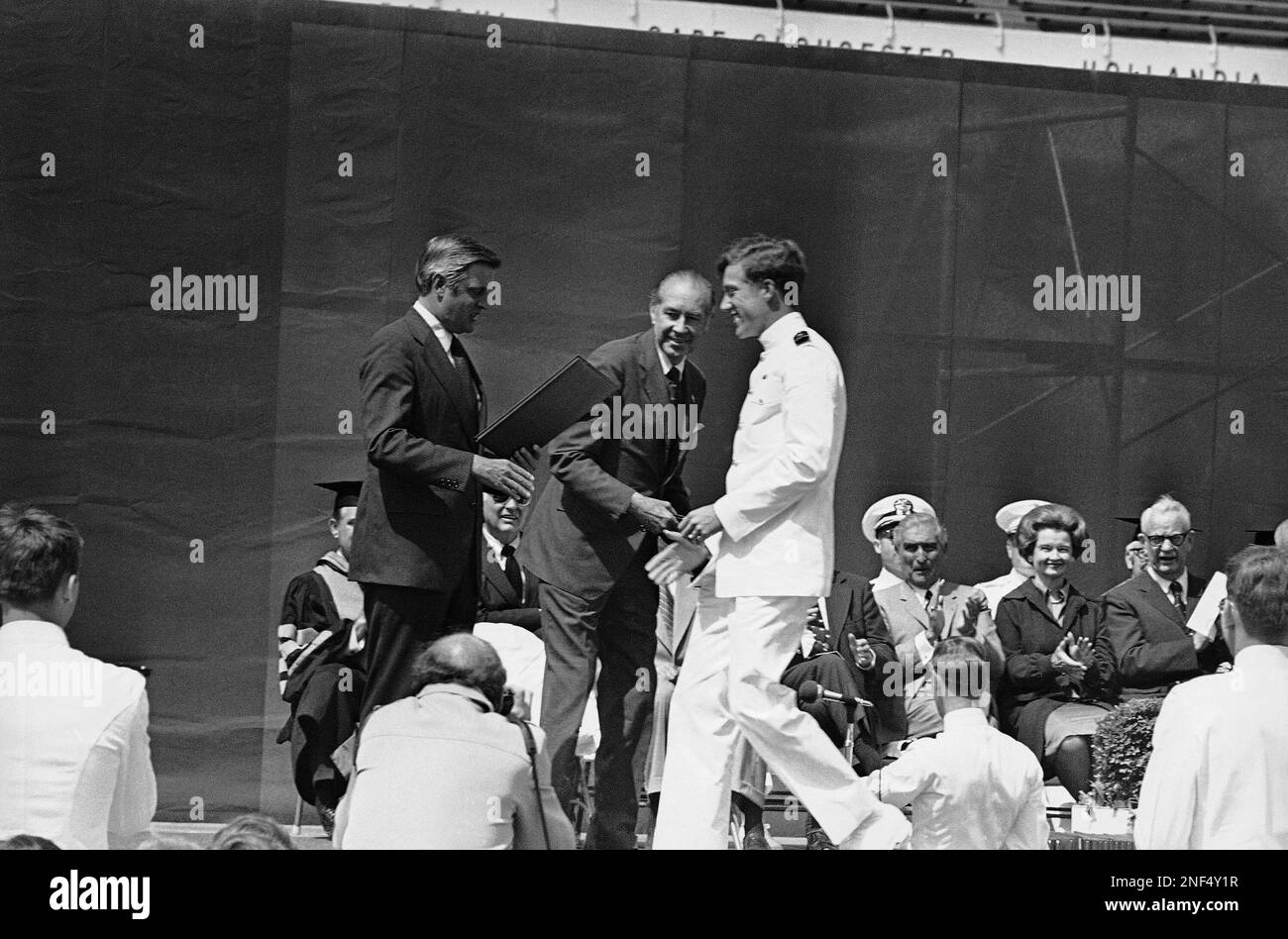 U.S. Vice President Walter Mondale hands the first diploma at the U.S ...