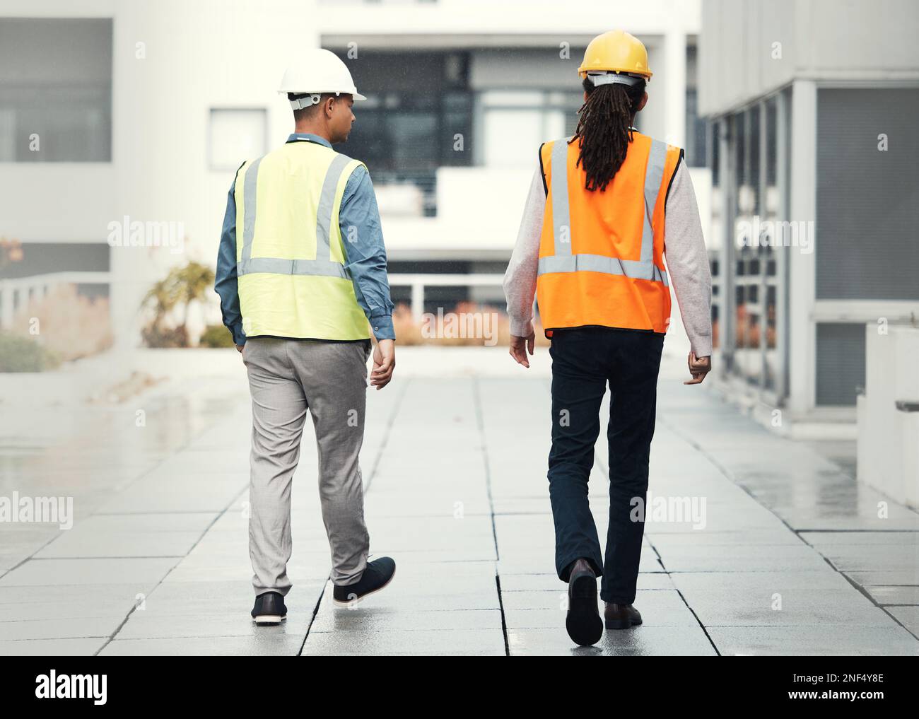 Engineer men back, city and walk for architecture, construction ...