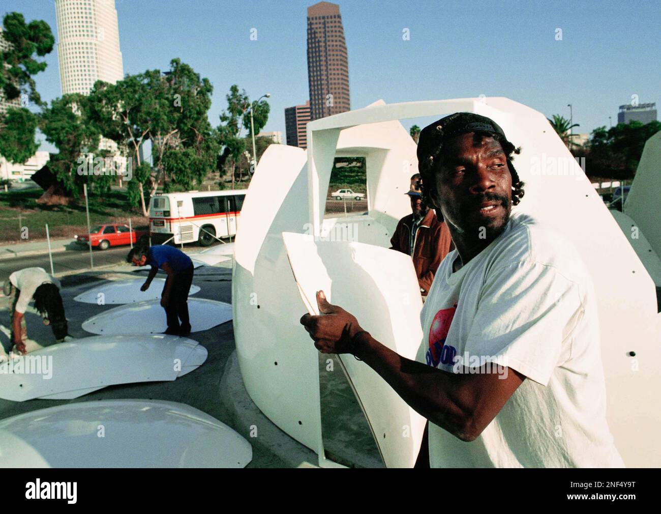 Larry Jackson, who is homeless, helps to construct one of 18 fiberglass ...