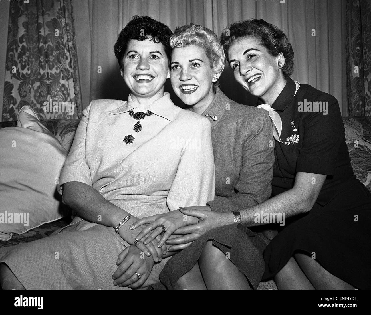 The singing Andrews Sisters, left to right, Maxene, Patty, and LaVerne ...