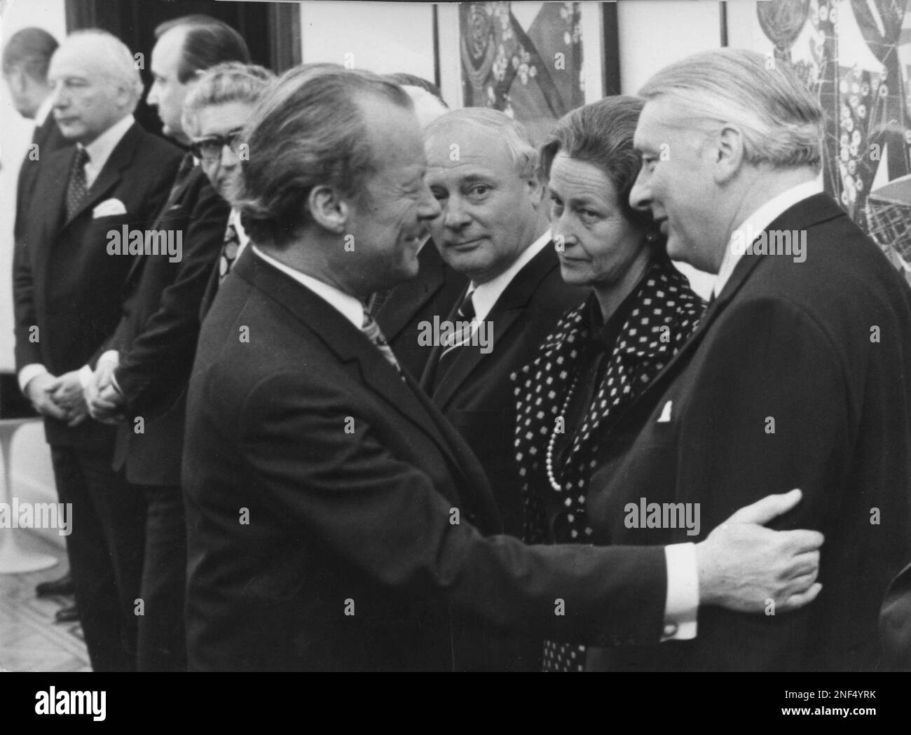 Former Chancellor, Willy Brandt, center, touches the arm of traffic ...