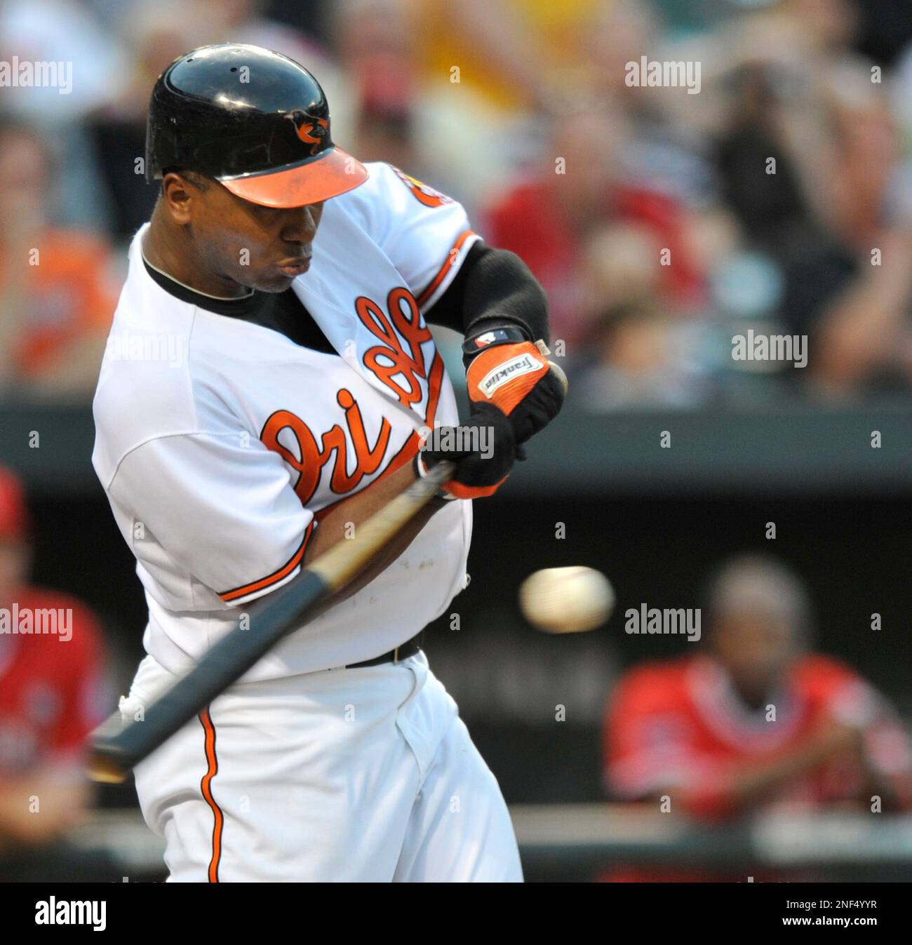 Baltimore Orioles' Melvin Mora swings on an RBI single against the Los ...