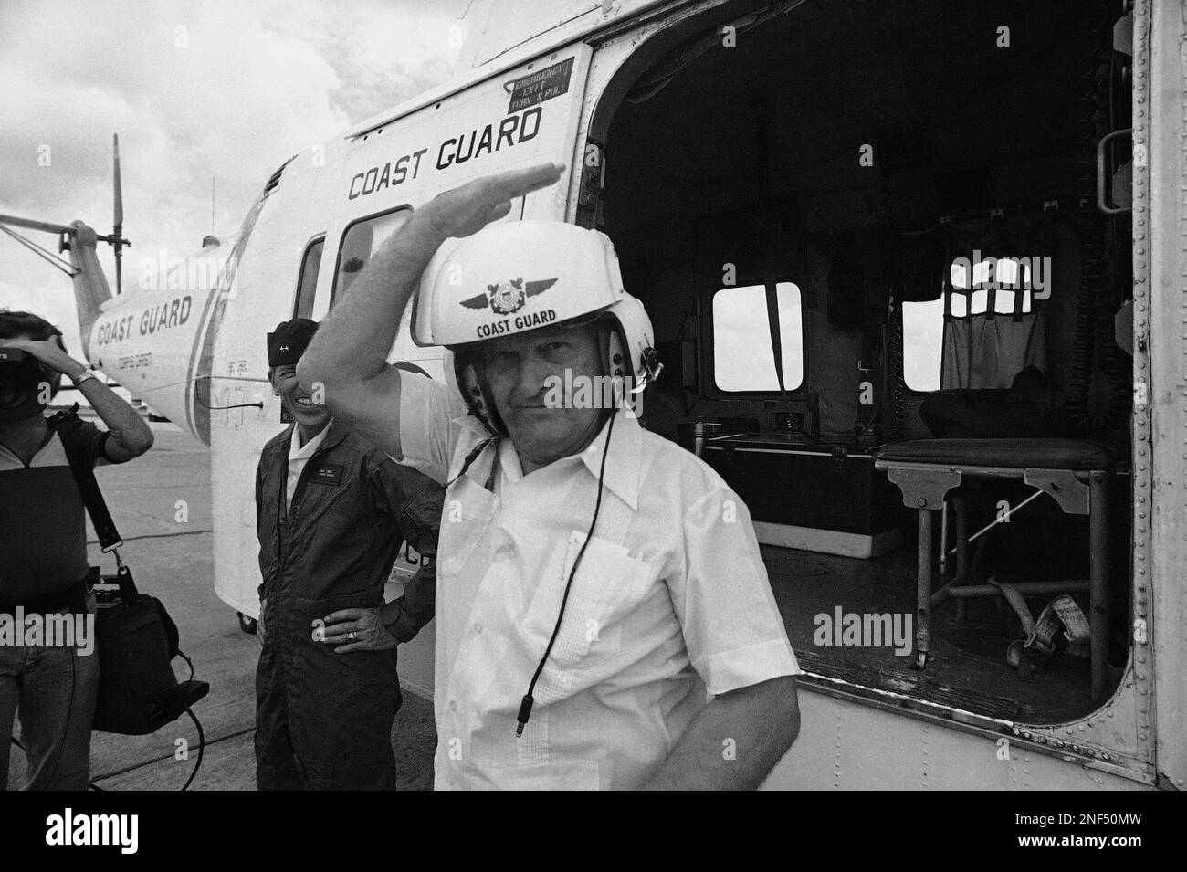 Texas Governor Bill Clements gives his flying helmet a final tap as he ...