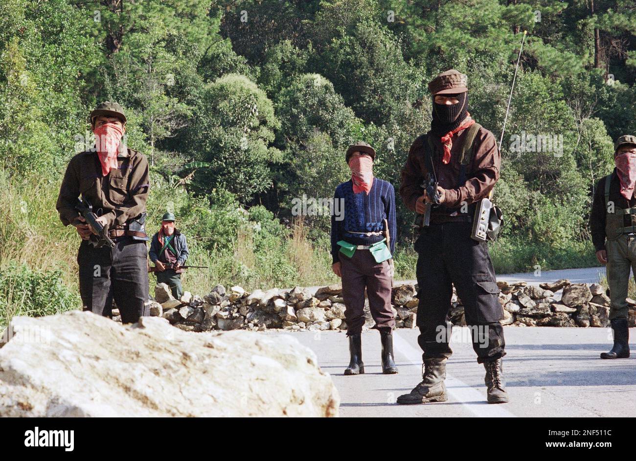 A commando unit of the Zapatista Army of National Liberation points ...