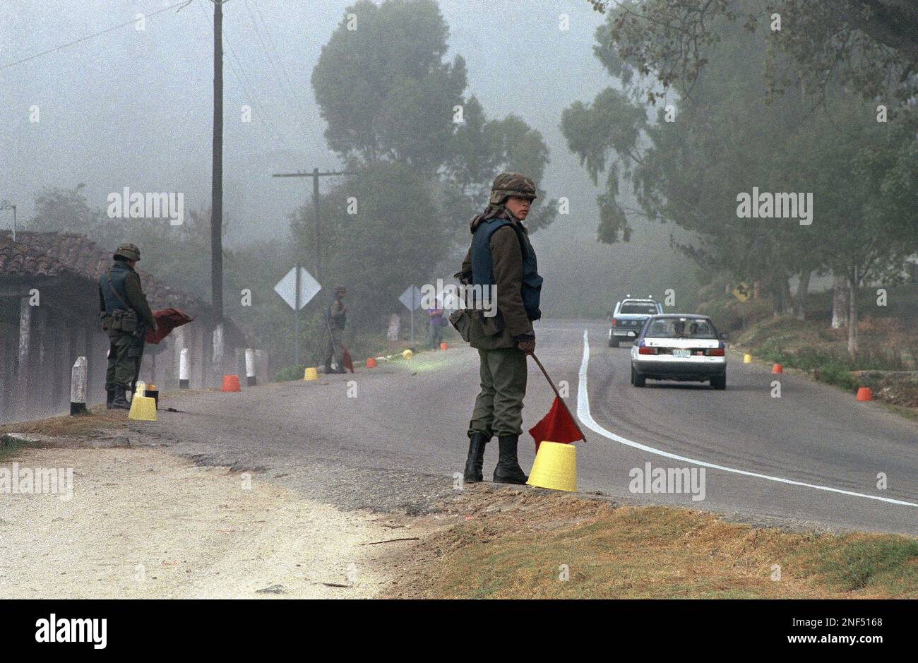 Mexican army troops stand guard at a checkpoint early, Dec. 20, 1994 ...