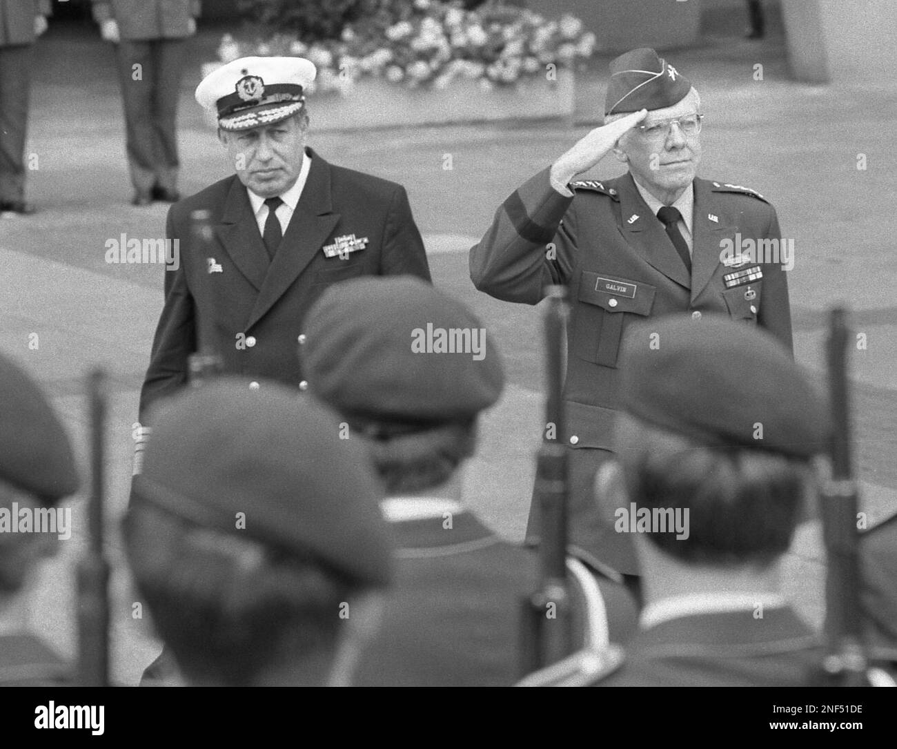 The new NATO commander-in-chief John R. Galvin, right, salutes the ...