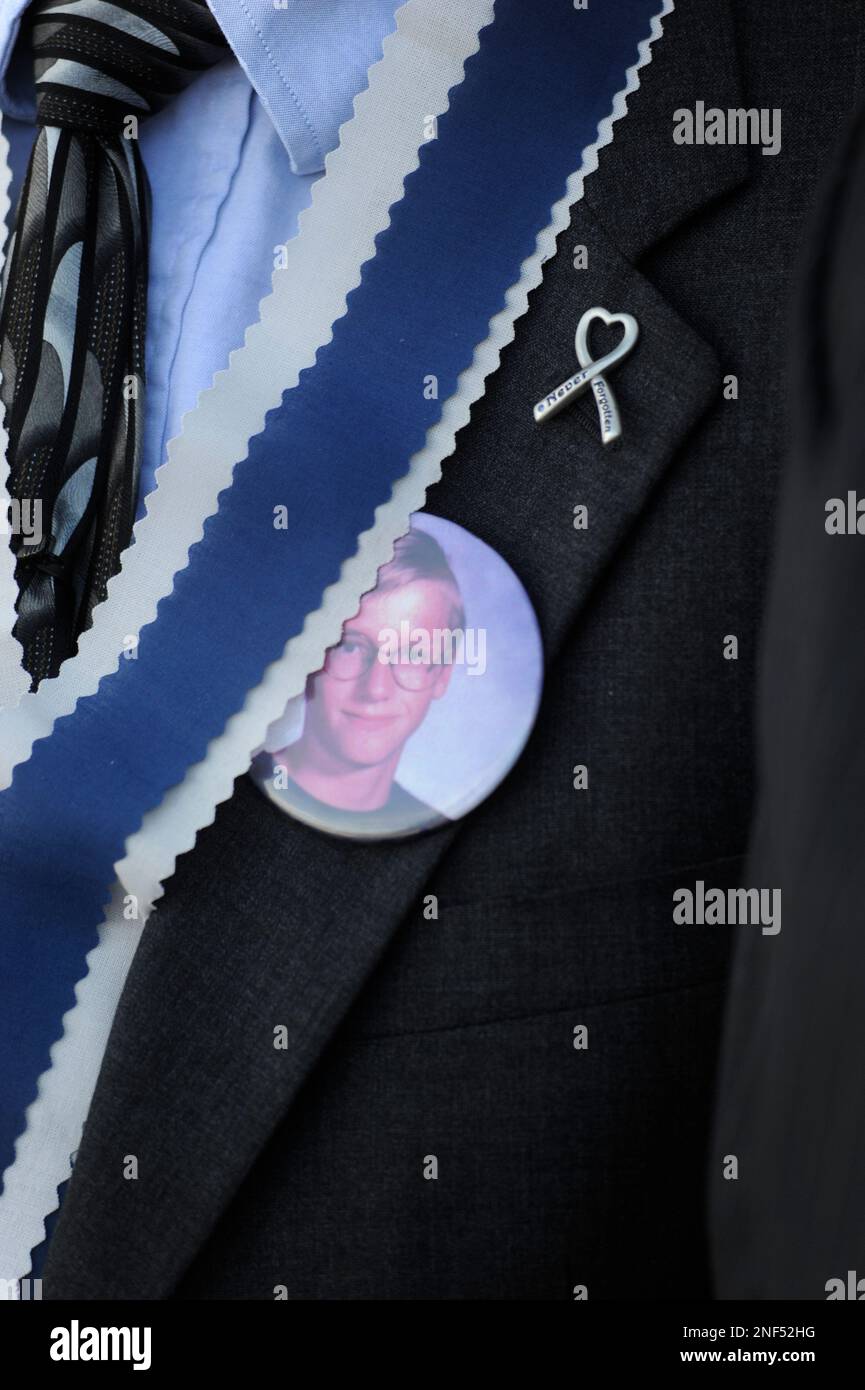 Tom Mauser, father of slain student Daniel Mauser, wears a button of ...