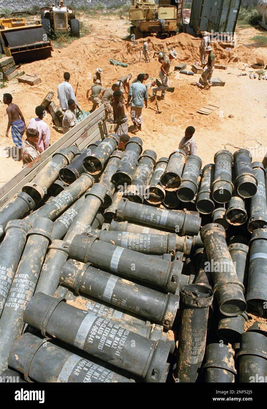 A truck loaded with propellant for 155mm artillery rounds sits next to ...