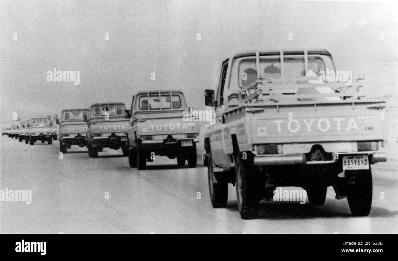 A Saudi Arabian military convoy of new Toyota trucks heads northeast on ...