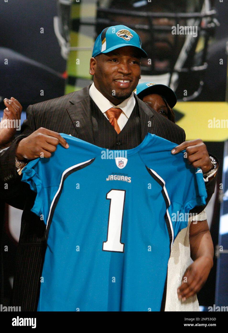 Virginia's Eugene Monroe poses for a photograph after he is selected as the No. 8 overall pick ...