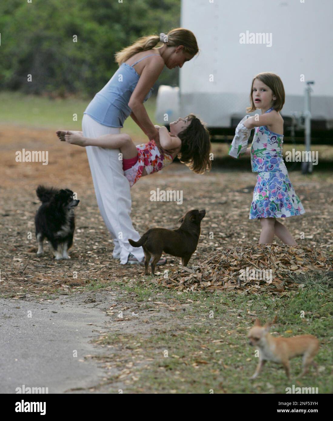 Megan Brogan plays with her daughters Madison, 4 and Alexis 7 outside ...