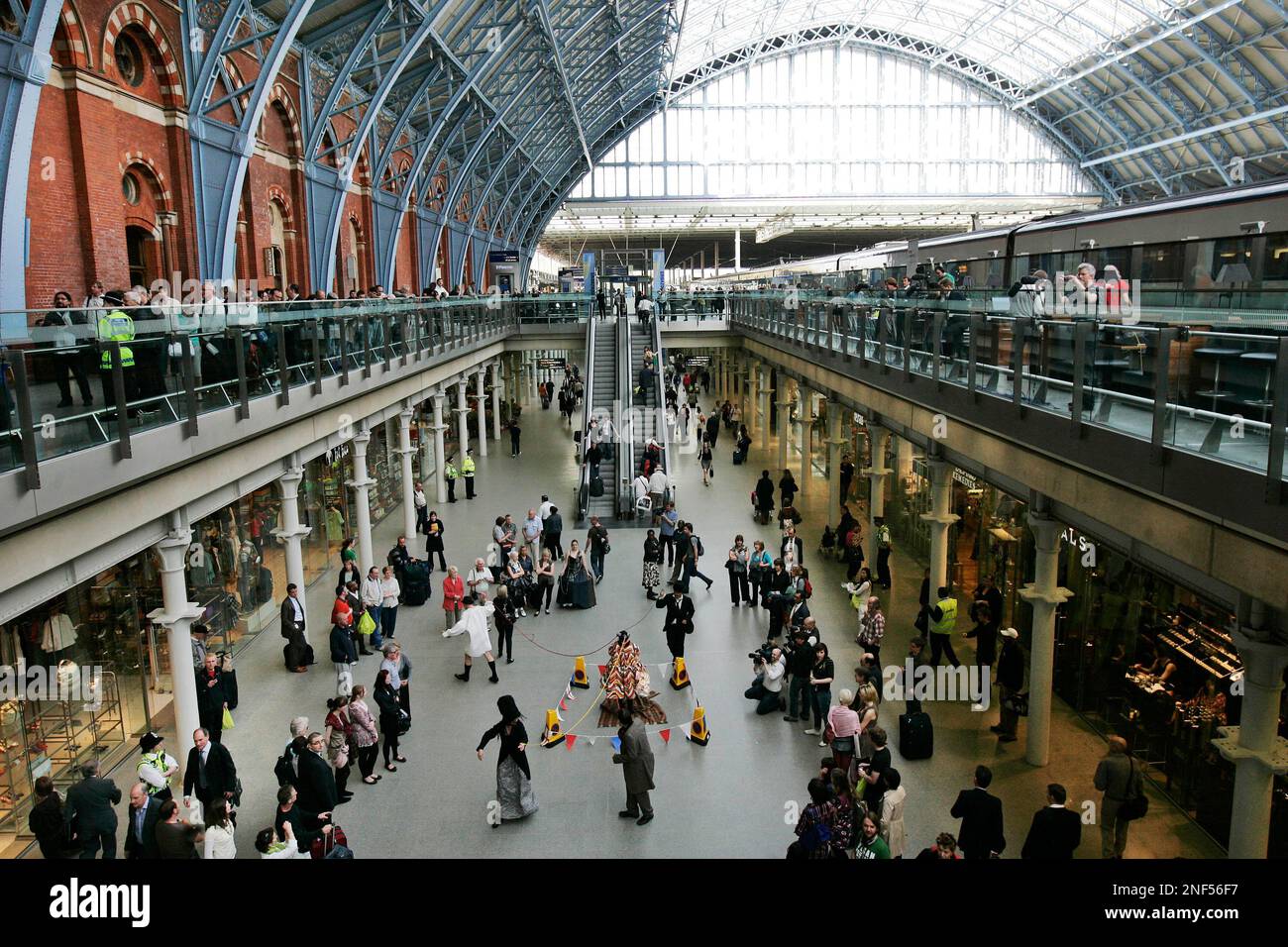 Performers from the theatre company Hoipolloi, bottom, sporting ...