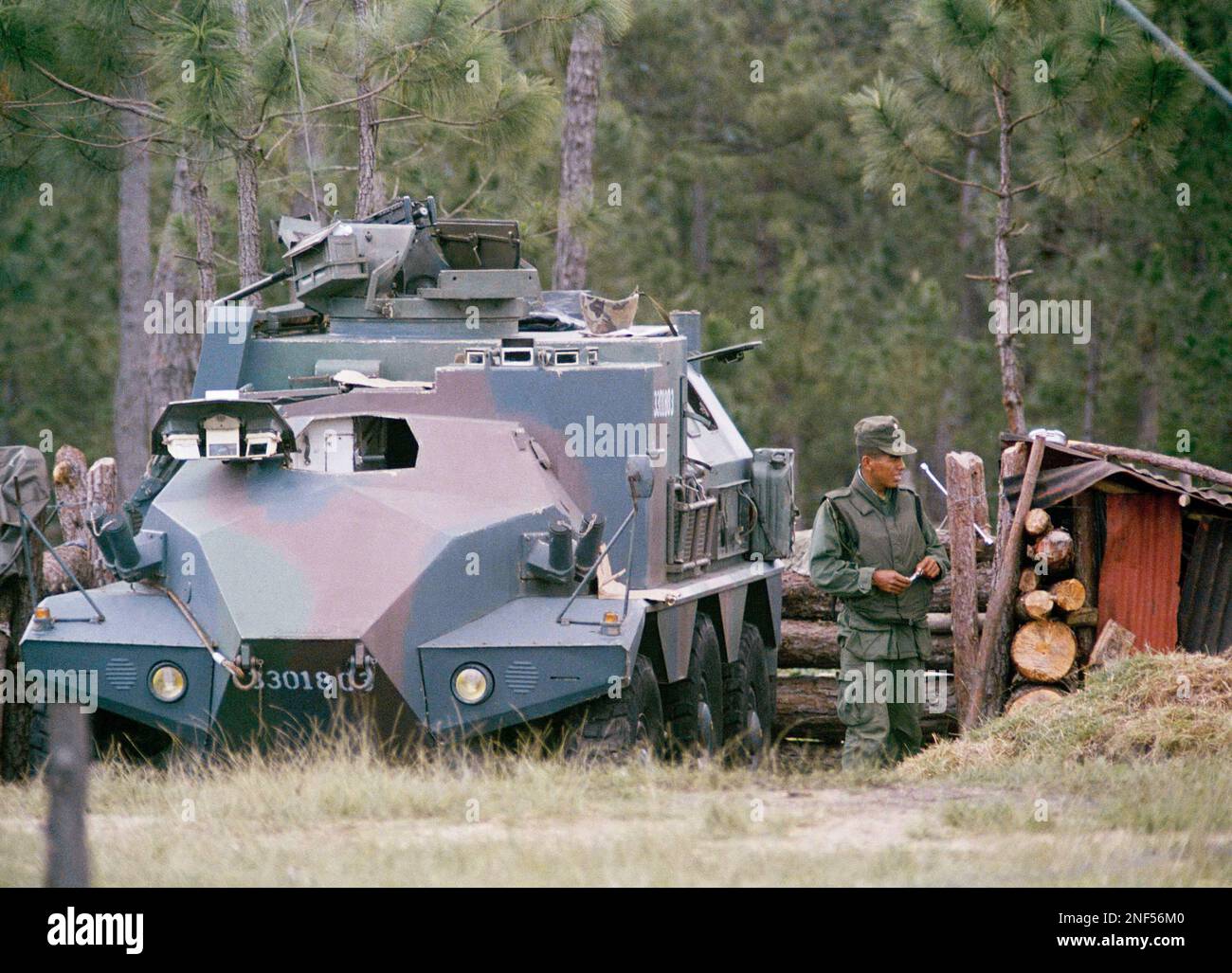 A Mexican soldier stands next to an armored vehicle at a checkpoint in ...
