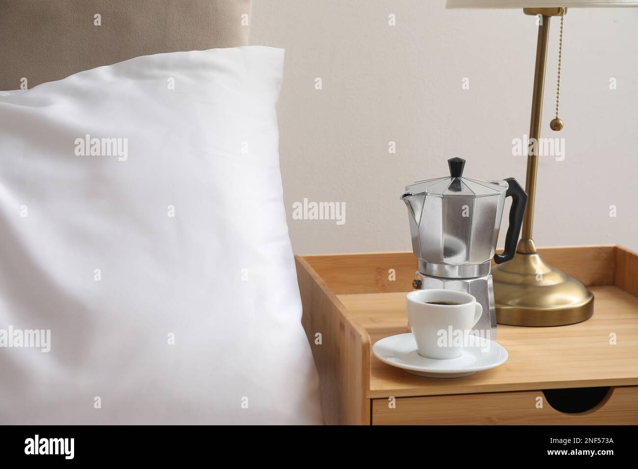 Geyser coffee maker and cup of espresso on nightstand near bed Stock ...
