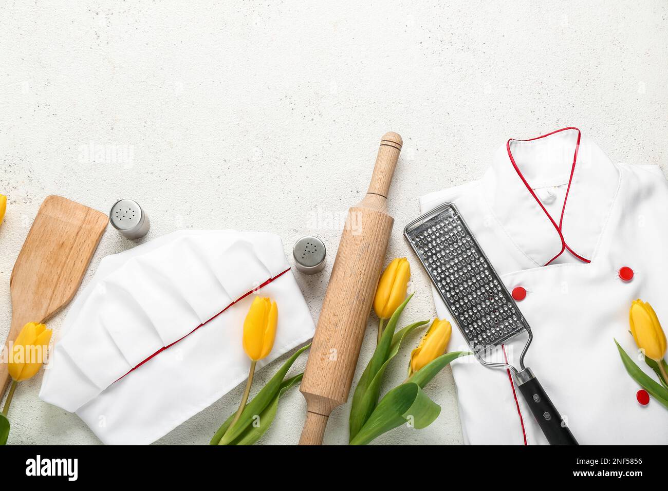 Chef's uniform with utensils and tulips on white background. Hello ...