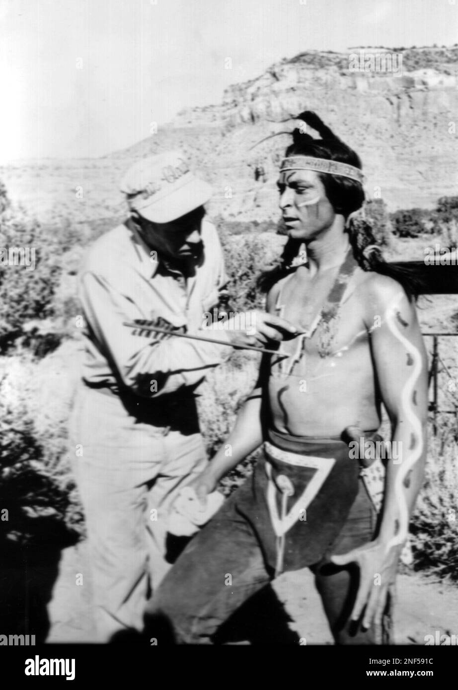 American actor Lee Van Cleef, right, is fitted with a special effects ...