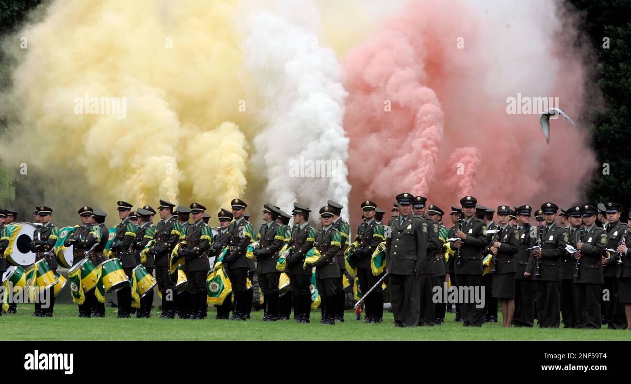 Police officers parade during a ceremony in Sibate, Colombia, Tuesday ...