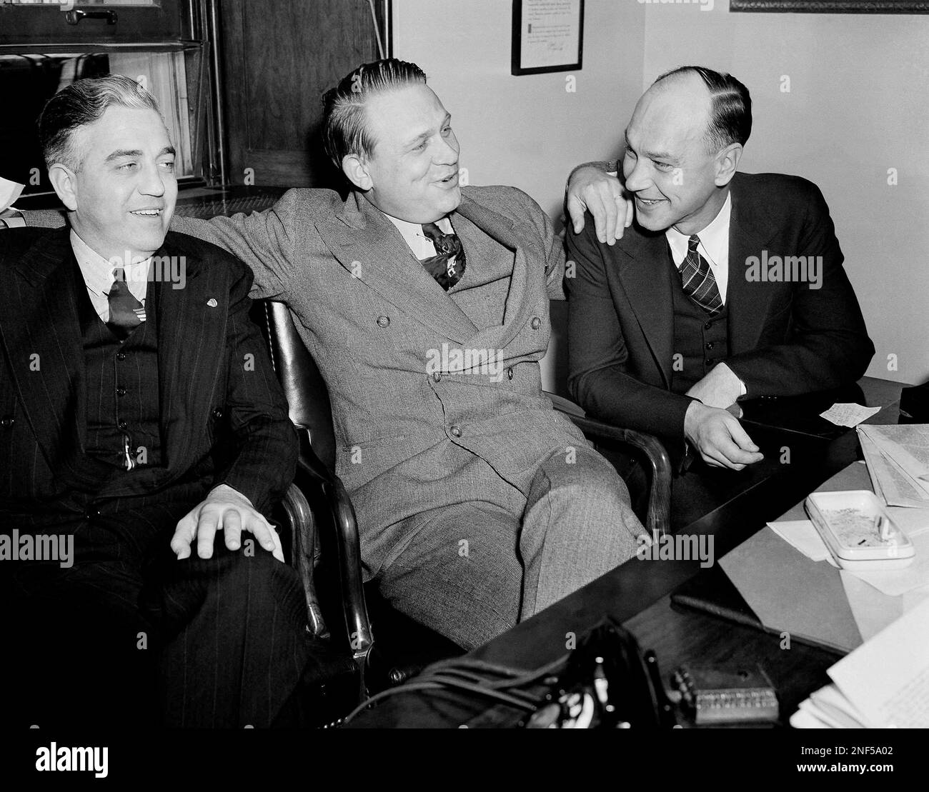 Chairman Martin Dies, center, (D-Tex.) is shown in his Washington, D.C ...