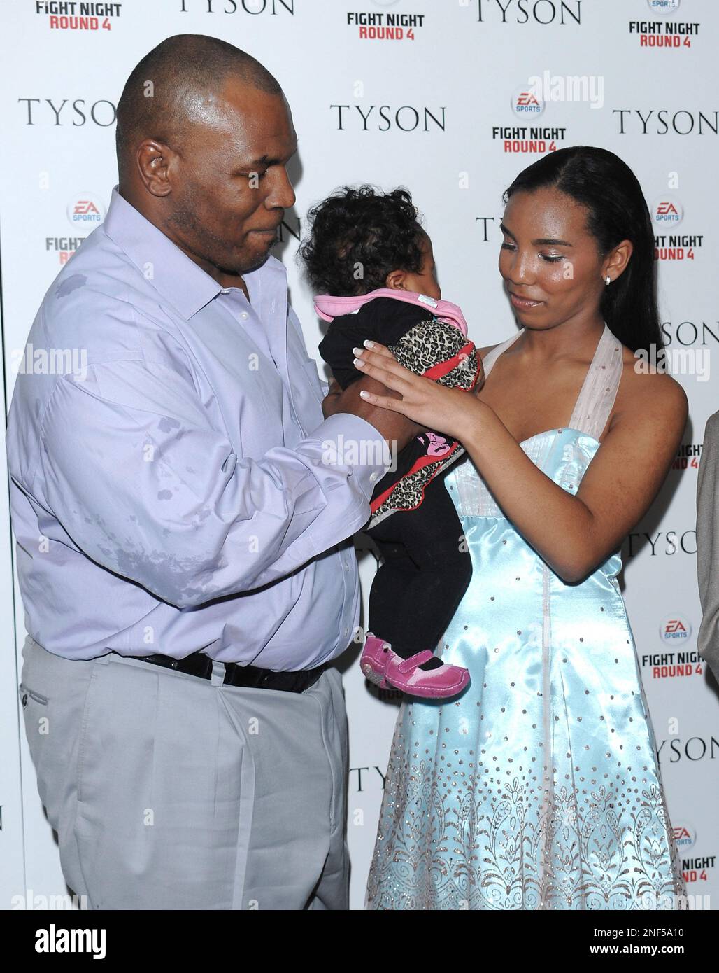 Former heavyweight boxing champion Mike Tyson poses with his children ...