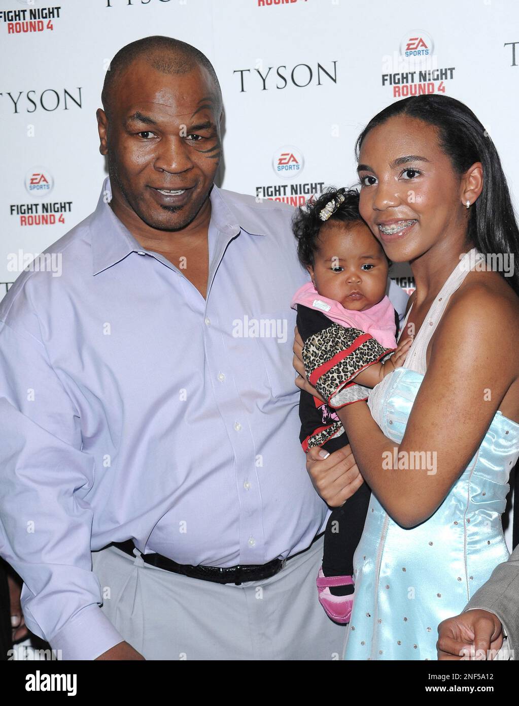 Former heavyweight boxing champion Mike Tyson poses with his children ...