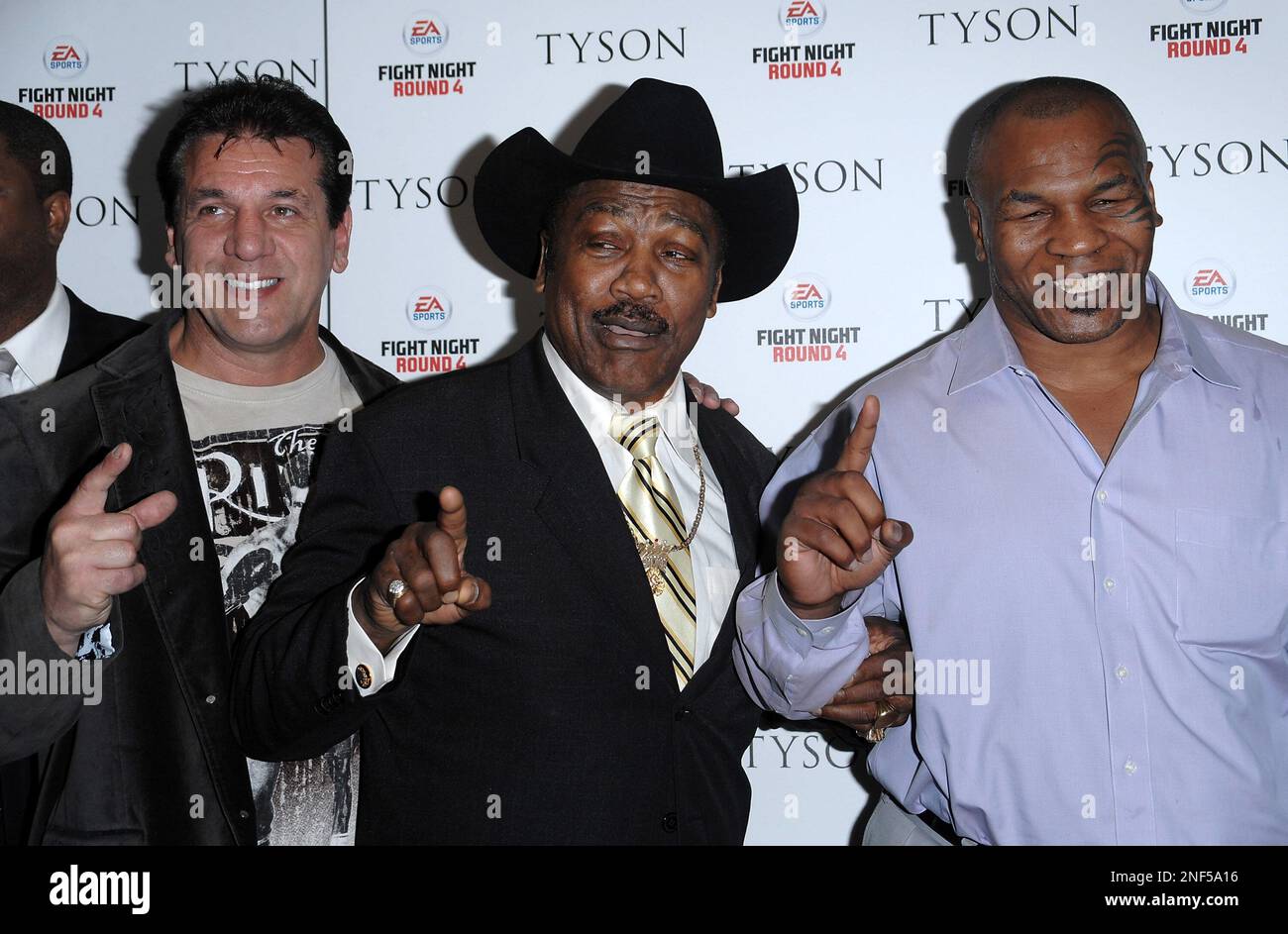 Chuck Zito poses with former heavyweight boxing champions Joe Frazier ...
