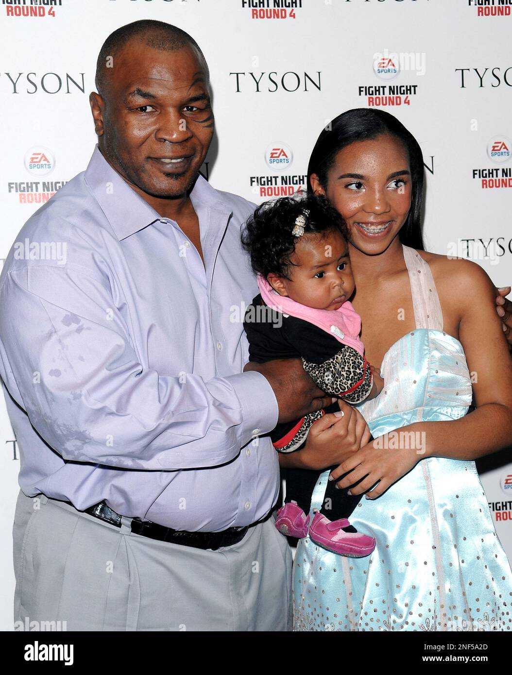 Former heavyweight boxing champion Mike Tyson poses with his children ...