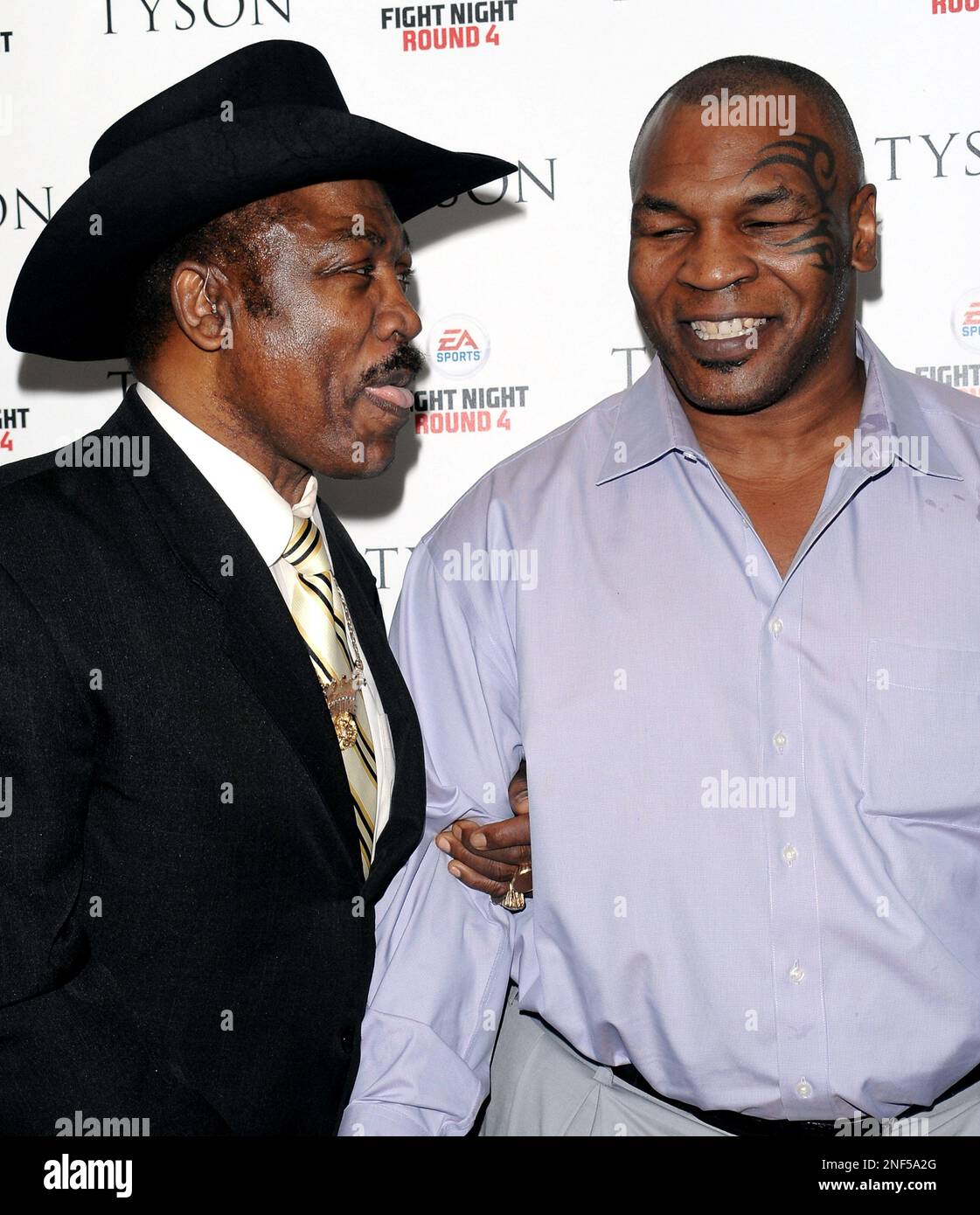Former heavyweight boxing champions Joe Frazier, left, and Mike Tyson ...