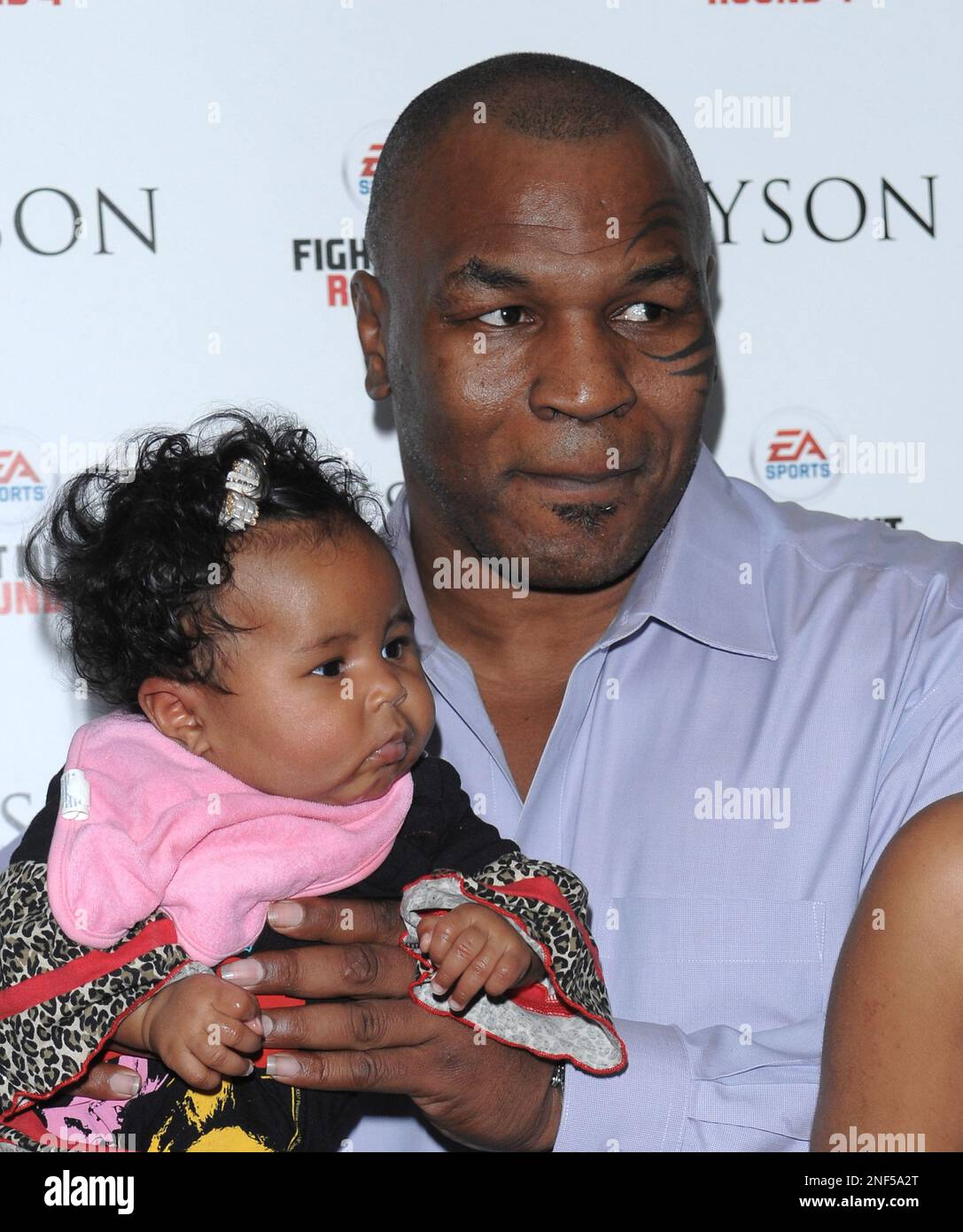 Former heavyweight boxing champion Mike Tyson poses with his children ...