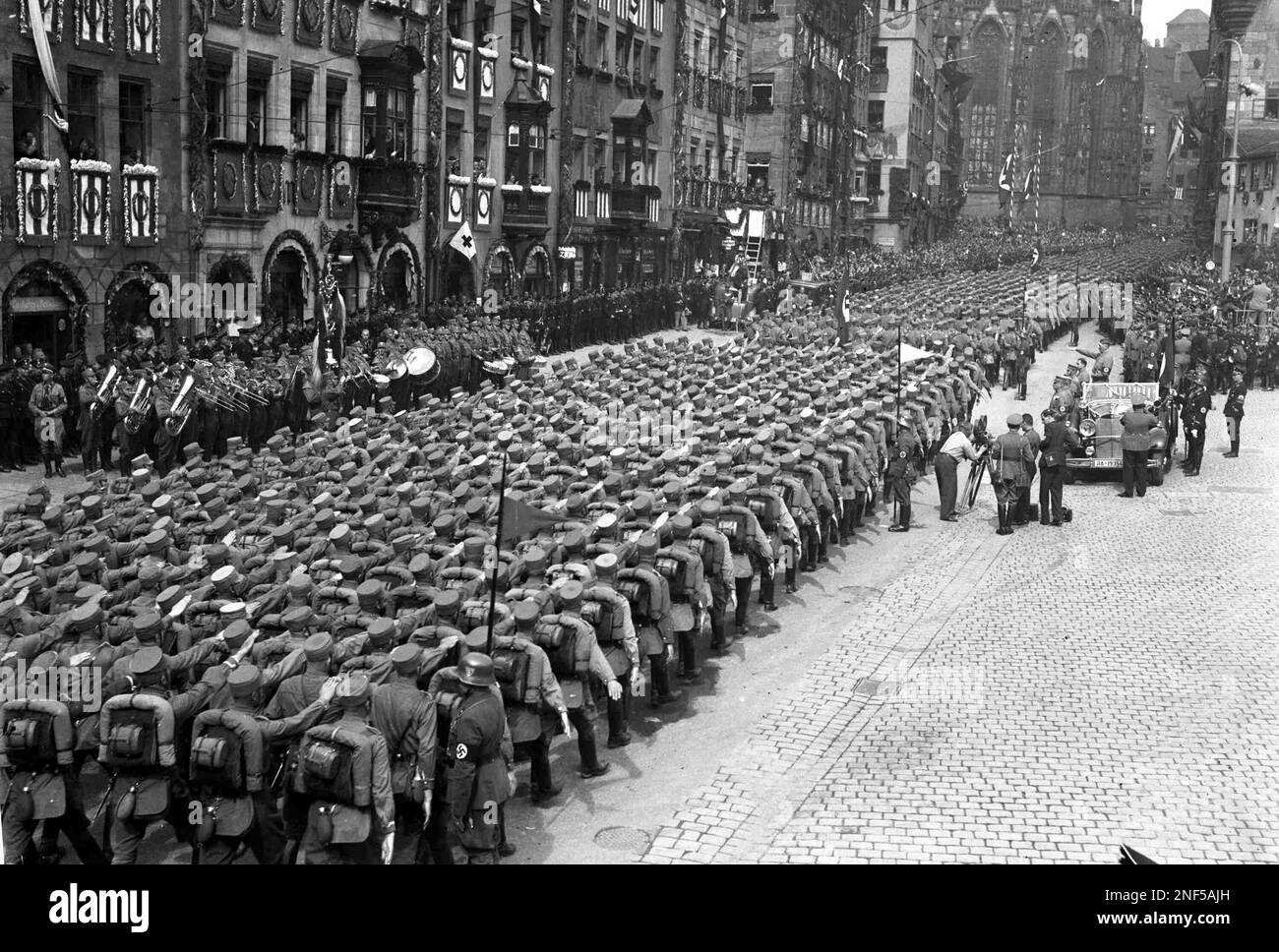 Long columns of brown-shirted stormtroopers march past German ...