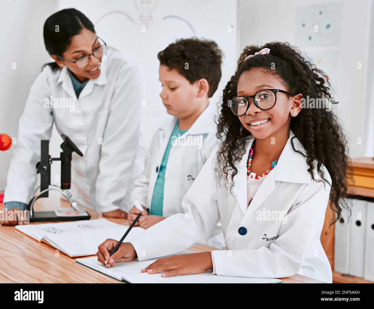 Getting good grades is what she does best. Portrait of an adorable ...