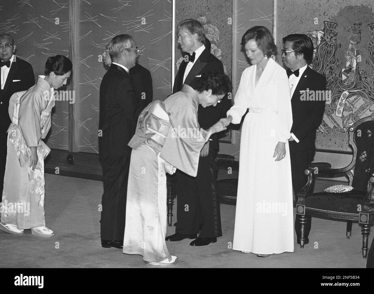 A Japanese lady bows to Mrs. Rosalynn Carter in the receiving line on ...