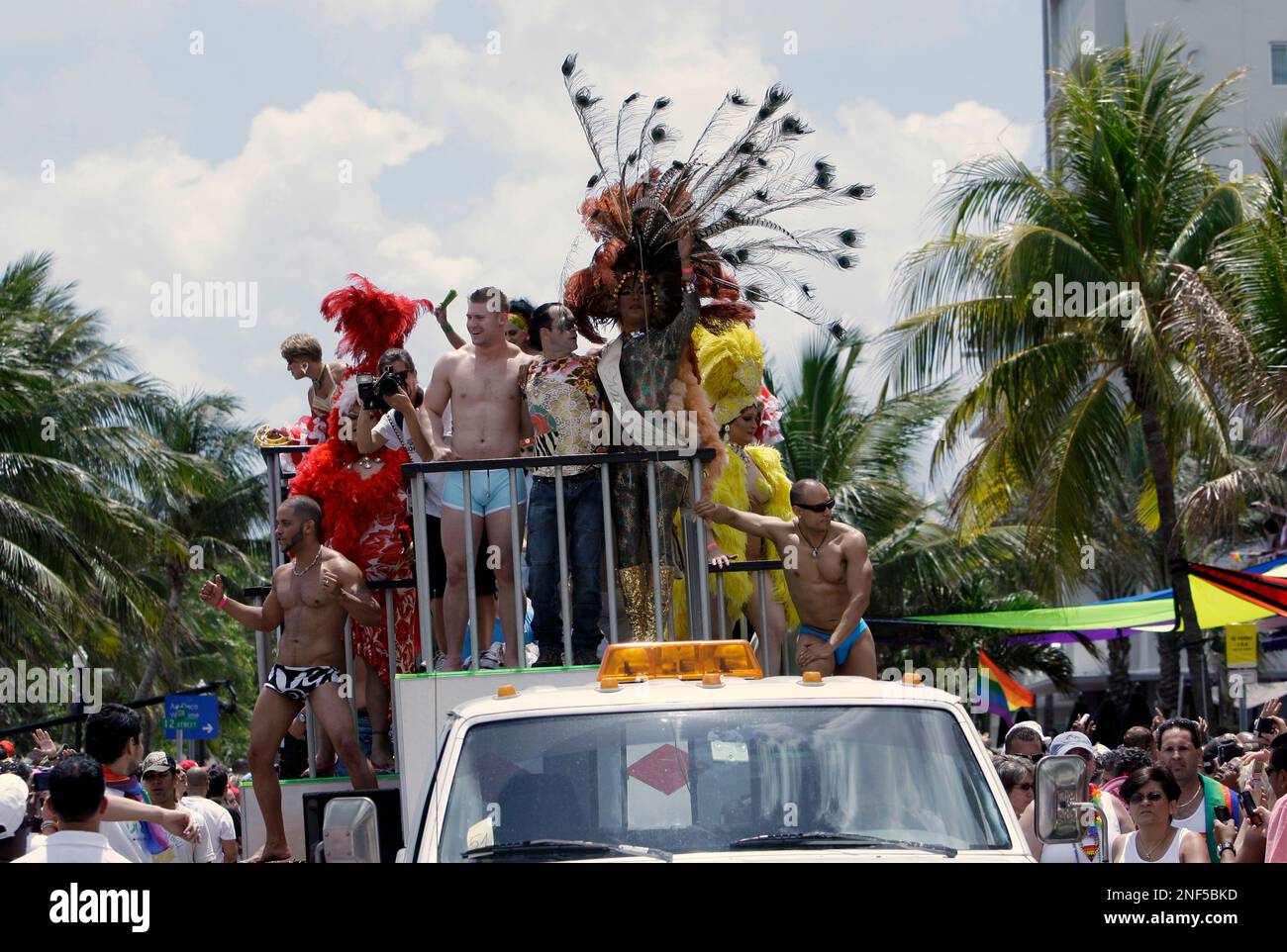 People dance on a float during the gay pride parade in Miami Beach, Fla ...