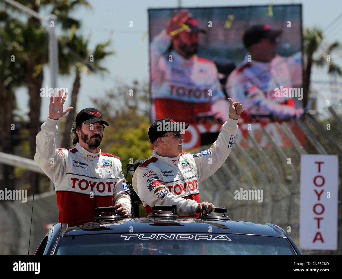 Celebrity driver Keanu Reeves, left, and professional driver Al Unser ...