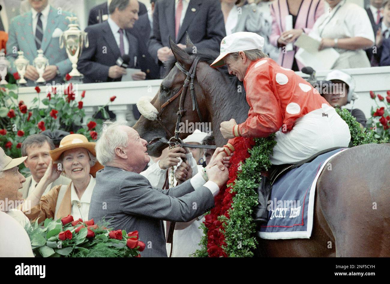 Jockey Pat Day, right, shakes hands with Lil E. Tee owner Cal Partee ...