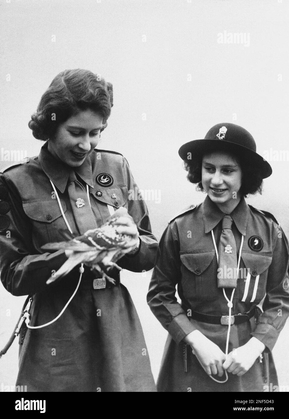 Princess Elizabeth of Great Britain, left, holds a pigeon, as Princess ...