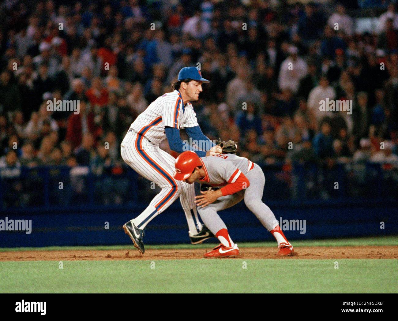 Cincinnati Reds Terry Francona tries to duck under New York Mets third ...
