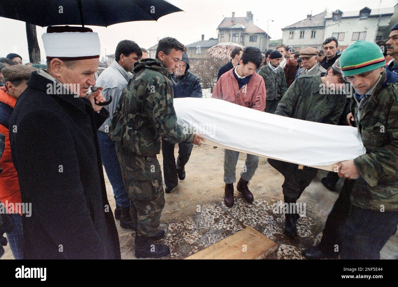 Bosnian Muslims carry the body of 27 year-old Samir Salihovic during ...