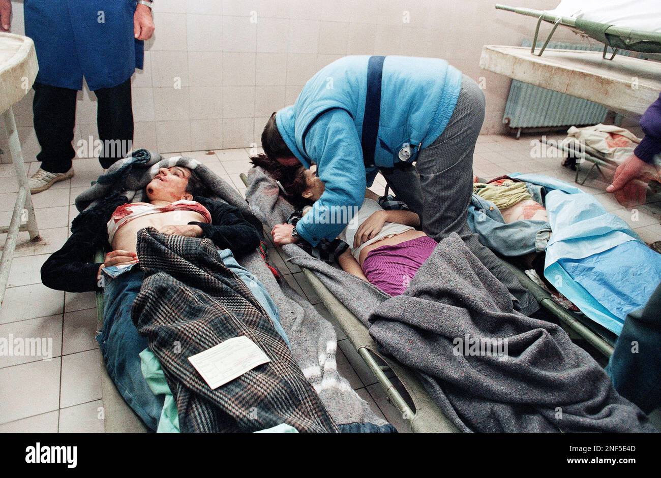 A man cries at the morgue in the Bosnian capital of Sarajevo, on ...