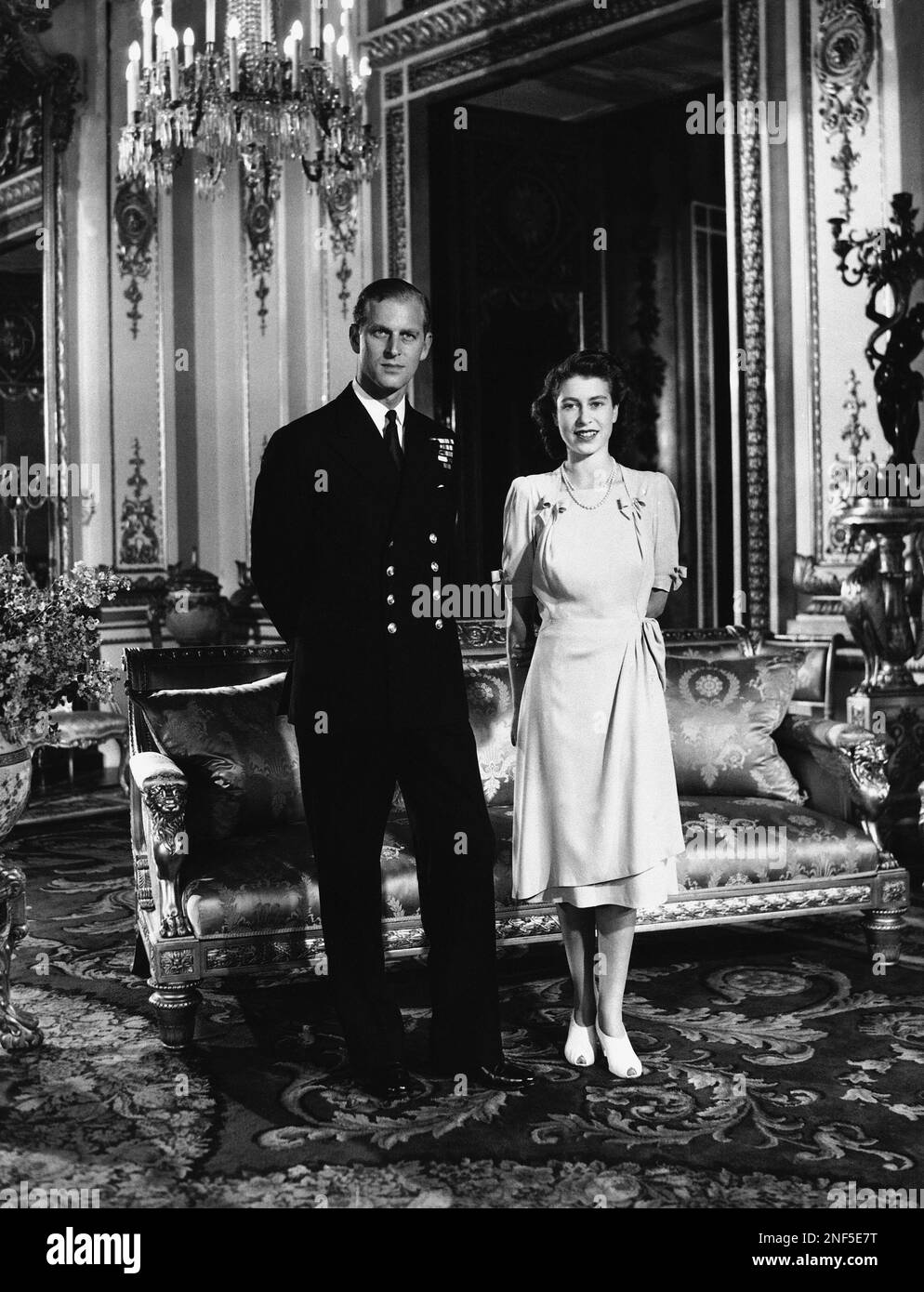 Princess Elizabeth, right, and fiancé, Lt. Philip Mountbatten, poses at Buckingham Palace, Aug ...
