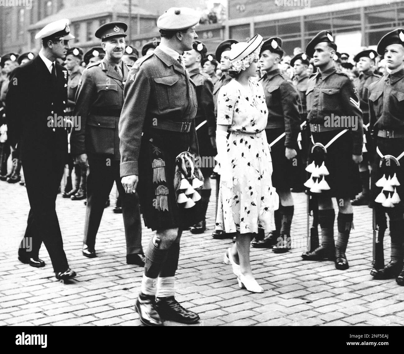 Princess Elizabeth, center right, inspects the guard of honor of the ...