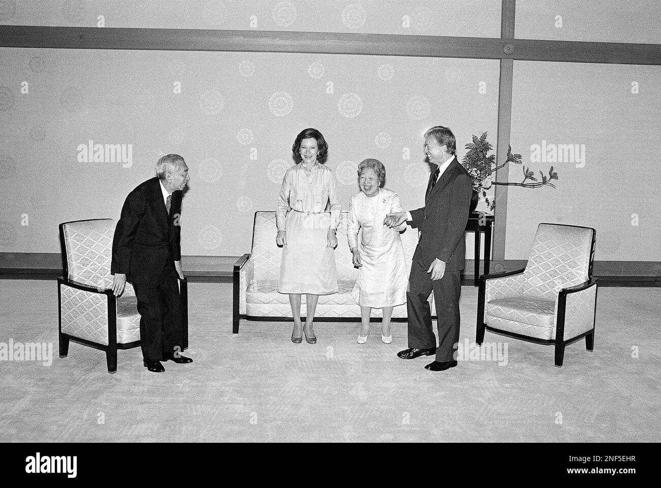 Pres. Jimmy Carter, right, helps Japans Empress Nagako as Carter ...