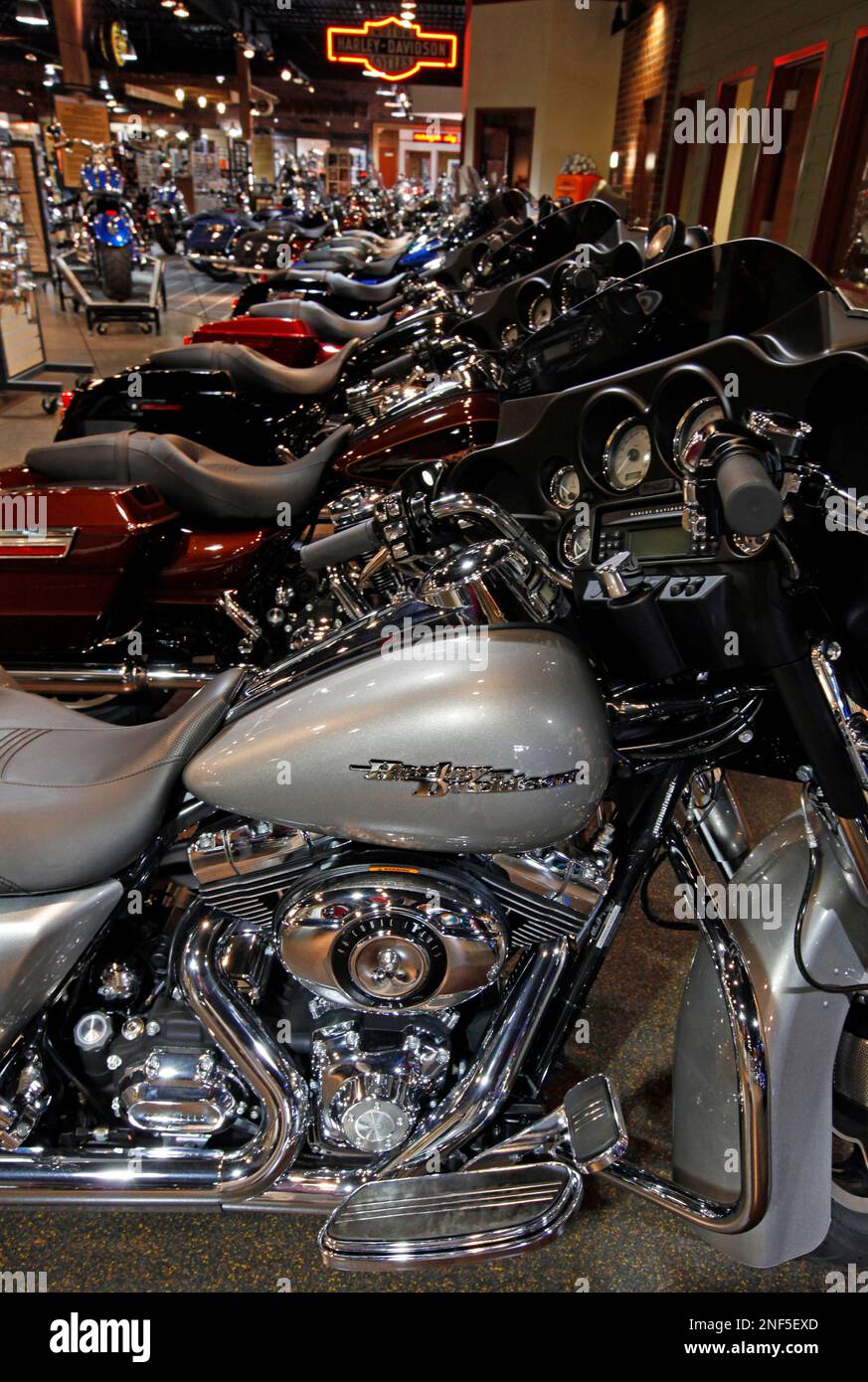 A row of Harley-Davidson motorcycles for sale are shown at the ...