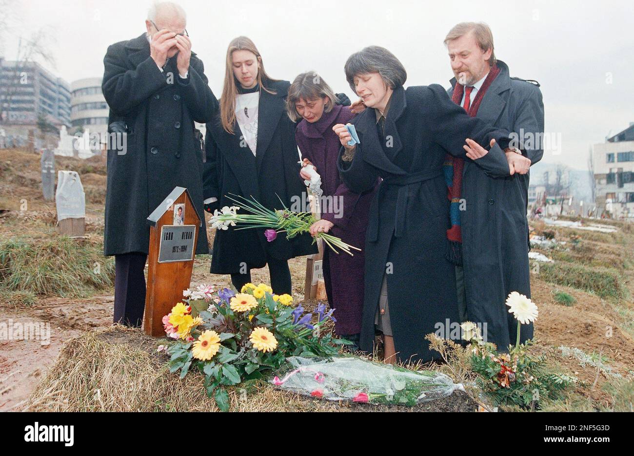 The Rehar family mourns over the grave of their son Igor Rehar in ...