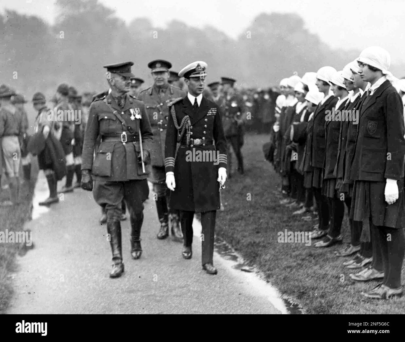 Britain's Duke of York, centre in naval uniform, inspects various ...