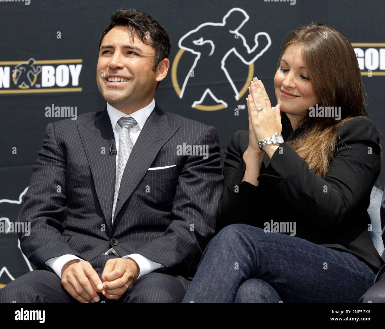 Hall of Fame fighter Oscar De La Hoya and his wife, Millie Corretjer ...