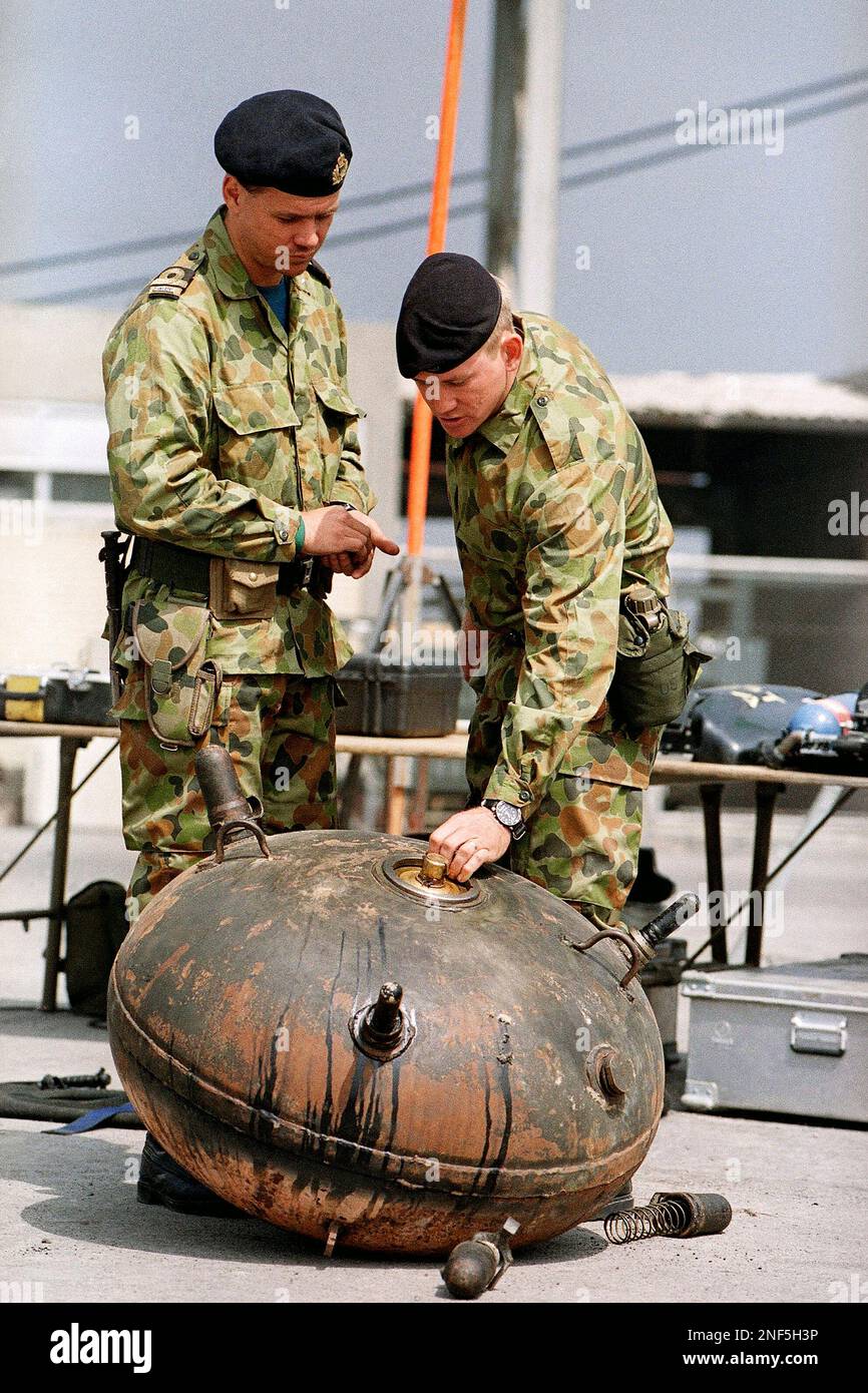Two members of an Australian Navy mine clearance diving team, Lt. Ian ...