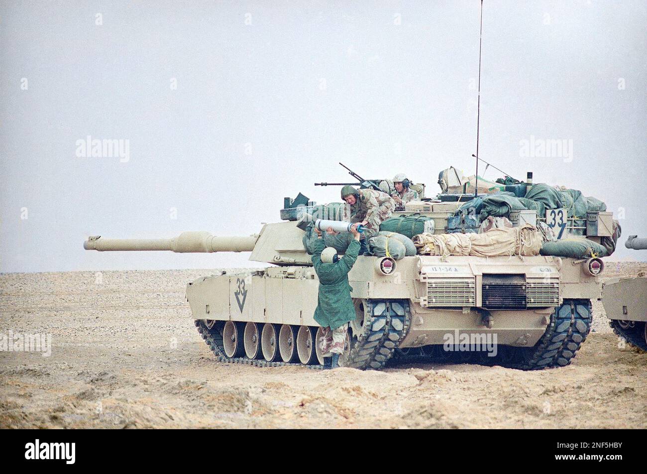 Members of the 101st Infantry Division, en route to battle positions ...