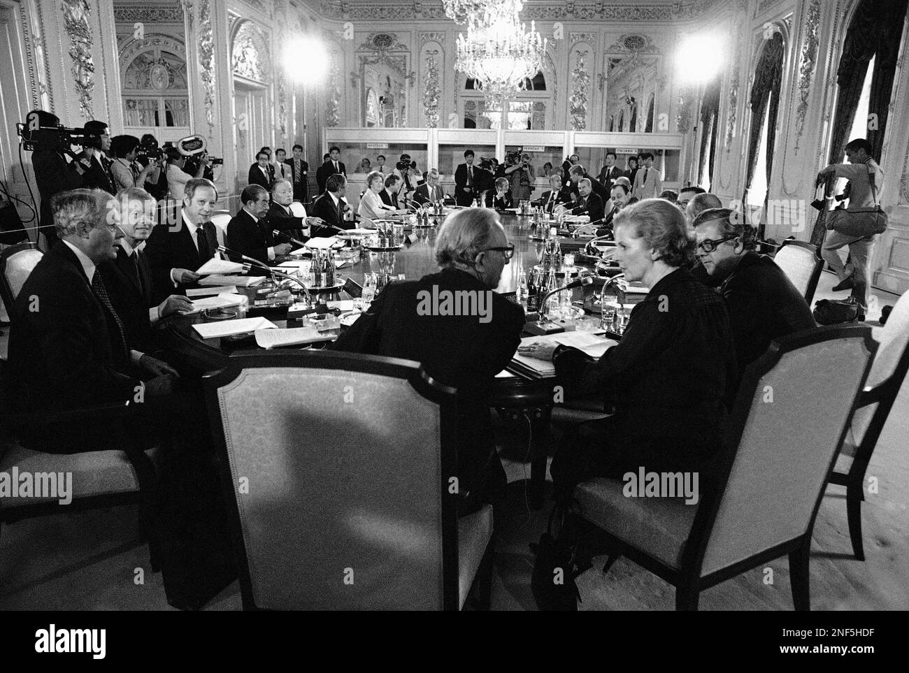British Prime Minister Margaret Thatcher, right, talks with cabinet ...
