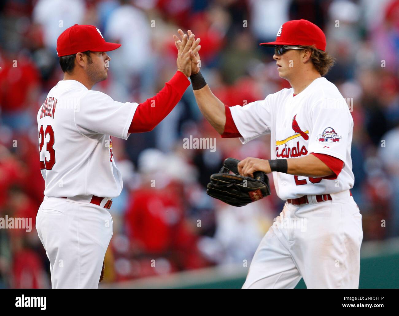St. Louis Cardinals' Brian Barden, left, celebrates with teammate Colby ...